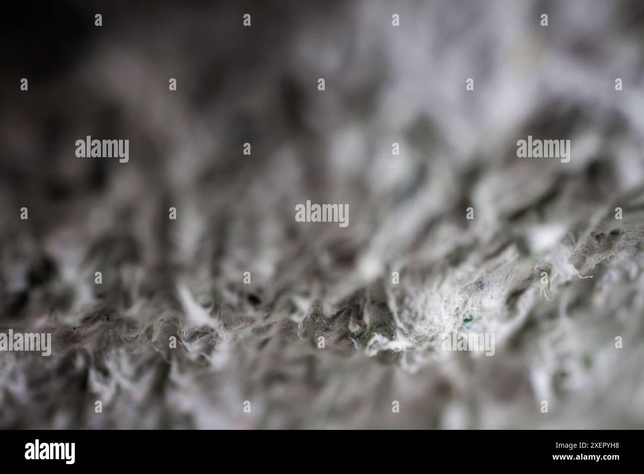 Extreme close up of old gray handmade paper mache with a structure and ...