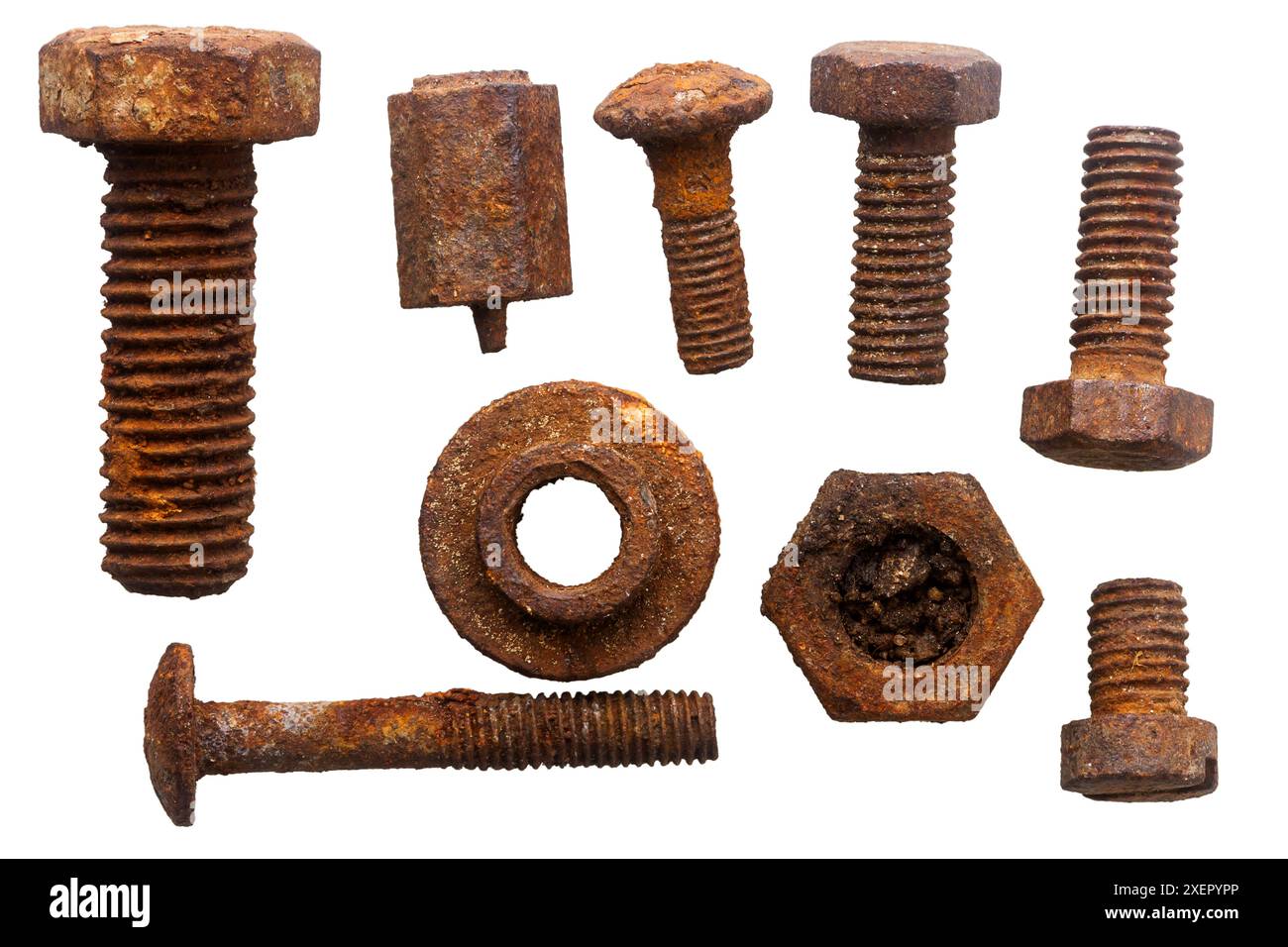 Collection of rusty bolts, screws, and nuts isolated on a white ...
