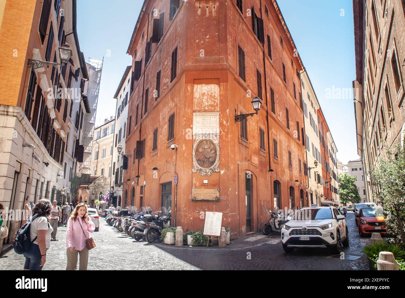 This image depicts the narrow, winding streets of old Rome ...