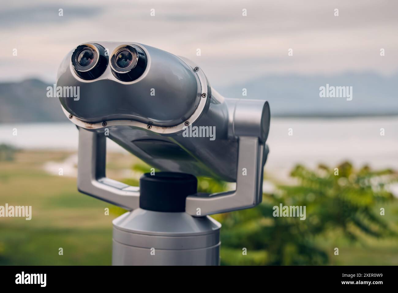 Metal telescope offering panoramic views of lakes and nature Stock ...