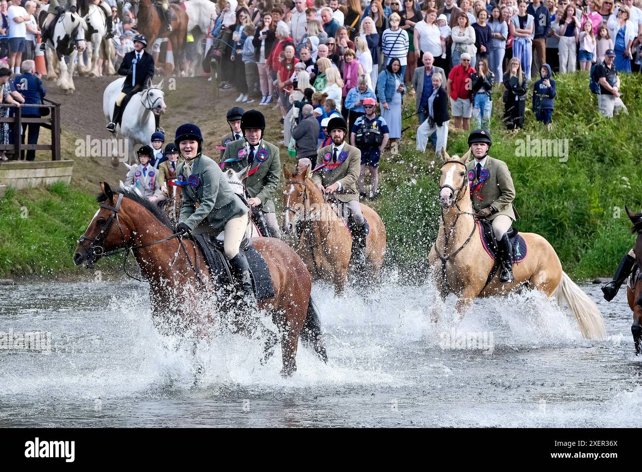 Galashiels, UK, 29 June 2024. Splashing cavalcade of 240 horses over ...