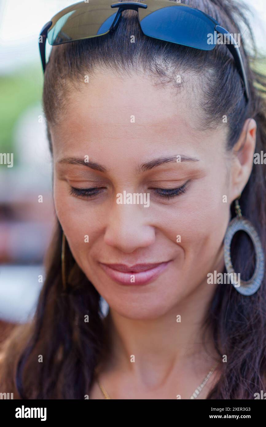 portrait of smiling single mixed race middle age woman outdoors Stock Photo - Alamy