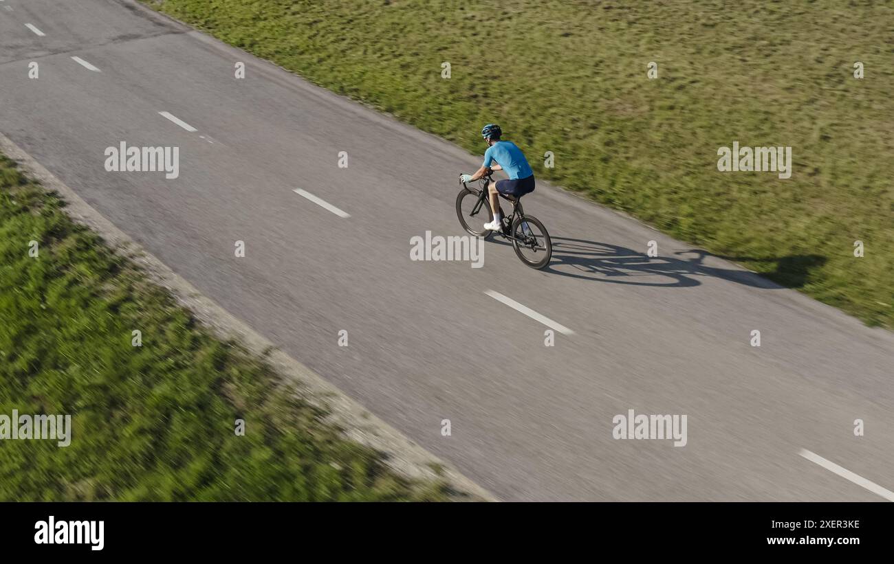 Aerial shot cyclist ride on hi-res stock photography and images - Alamy