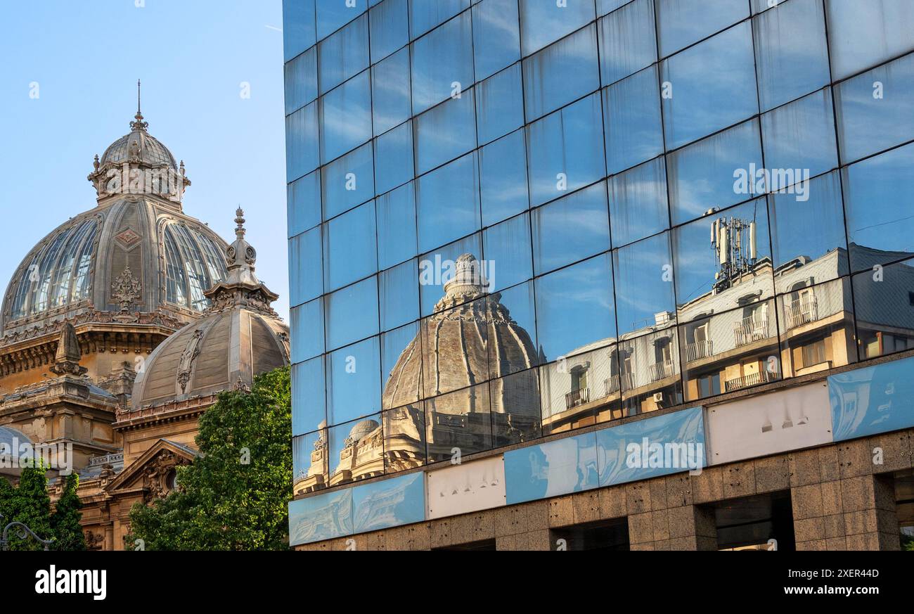 dome of the CEC palace mirroring in the glass facade of the Novotel ...