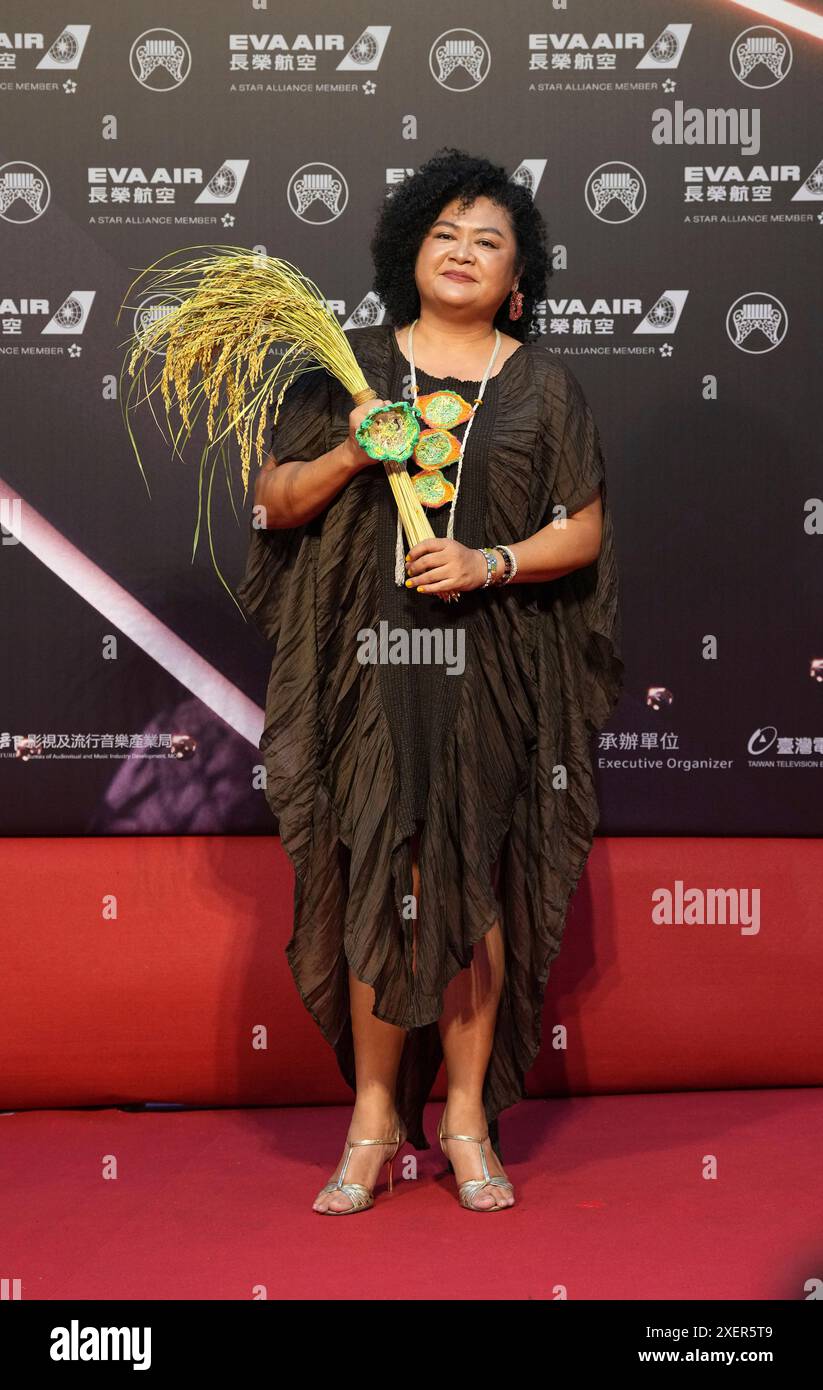 Taiwanese singer Panai Kusui poses for a photo as she arrives for the ...