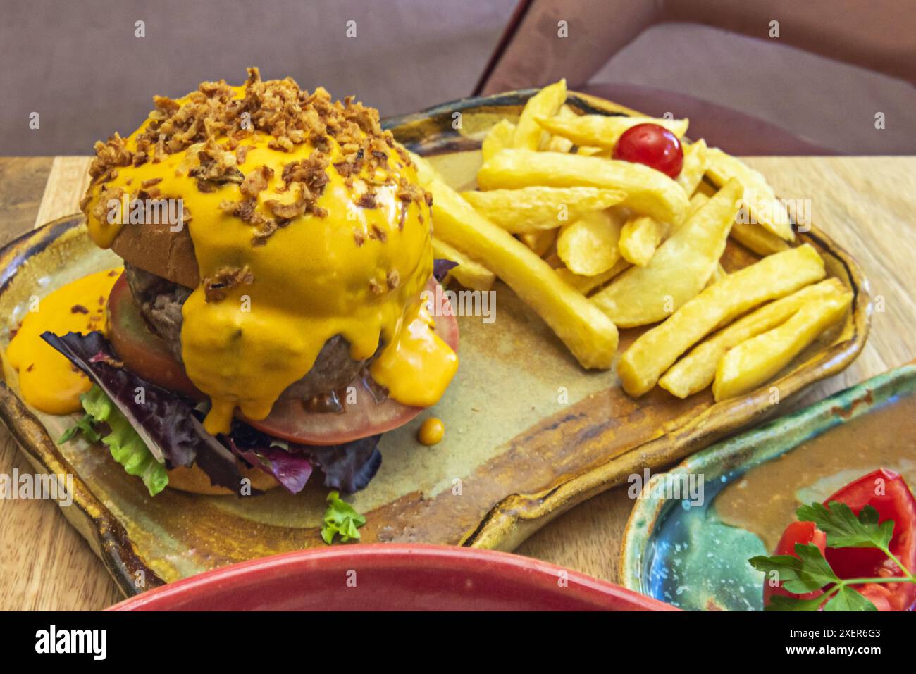 The combination of juicy meat, melted cheese, fresh vegetables, and ...