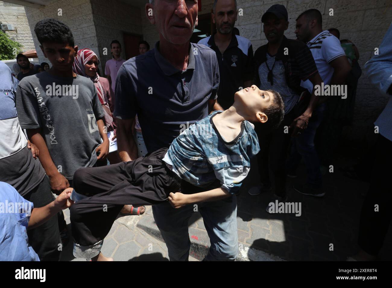 Relatives of the Palestinians died in Israeli attacks, mourn as they ...