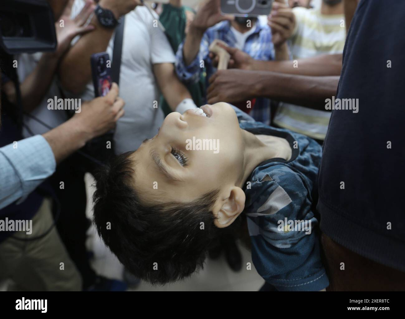 Relatives of the Palestinians died in Israeli attacks, mourn as they ...