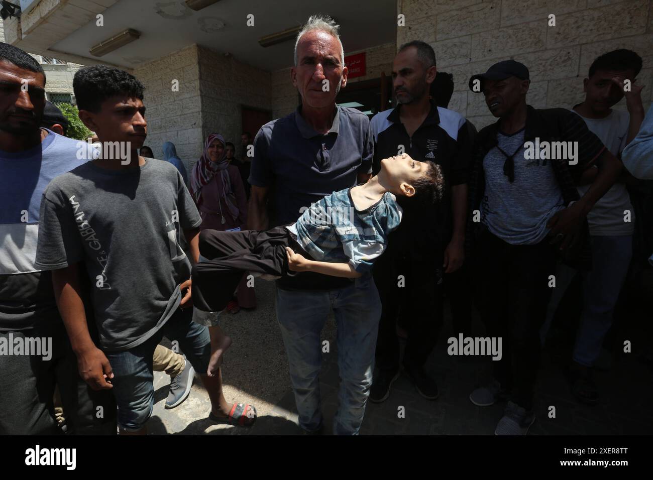 Relatives of the Palestinians died in Israeli attacks, mourn as they ...