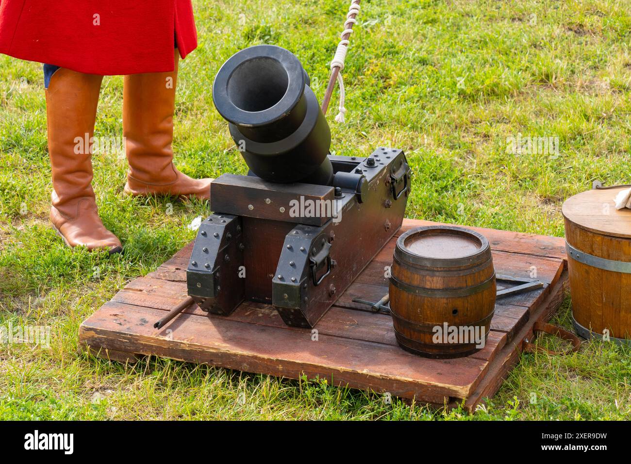 Medieval small mortar with gunpowder barrel on a green field Stock ...