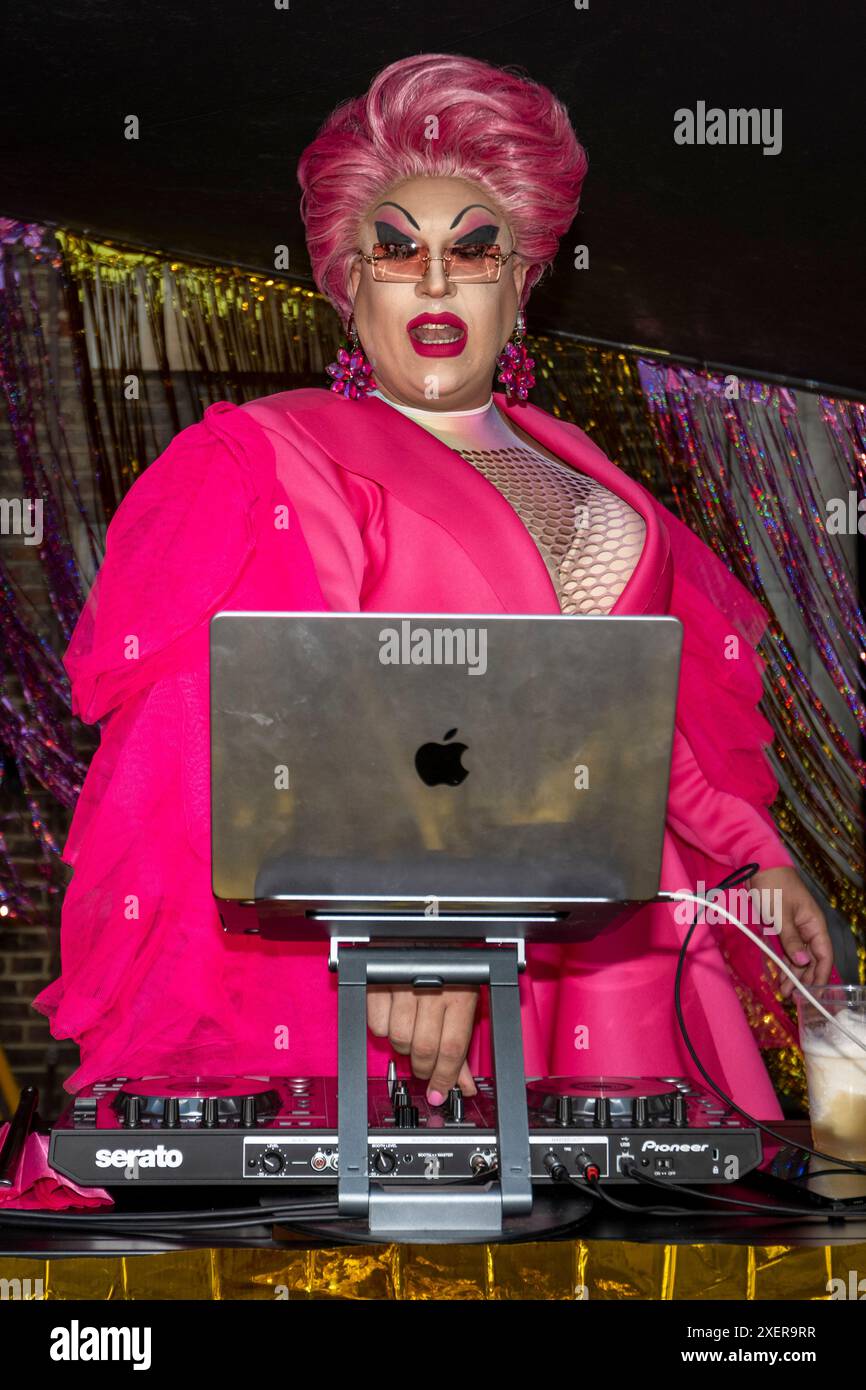London, UK. 29 June 2024. A drag queen DJ entertains the public in ...