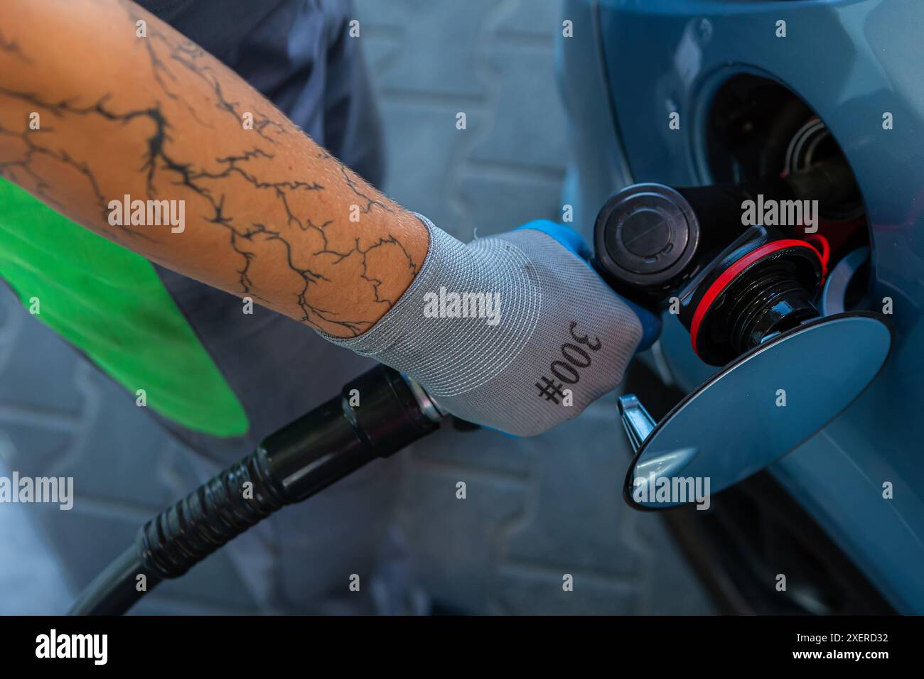 Hand Man Refill and filling Oil Gas Fuel at station. Gun petrol in the ...