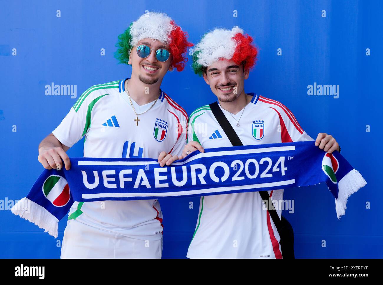 Italy fans holding a UEFA Euro 2024 branded scarf pose for photos ahead ...