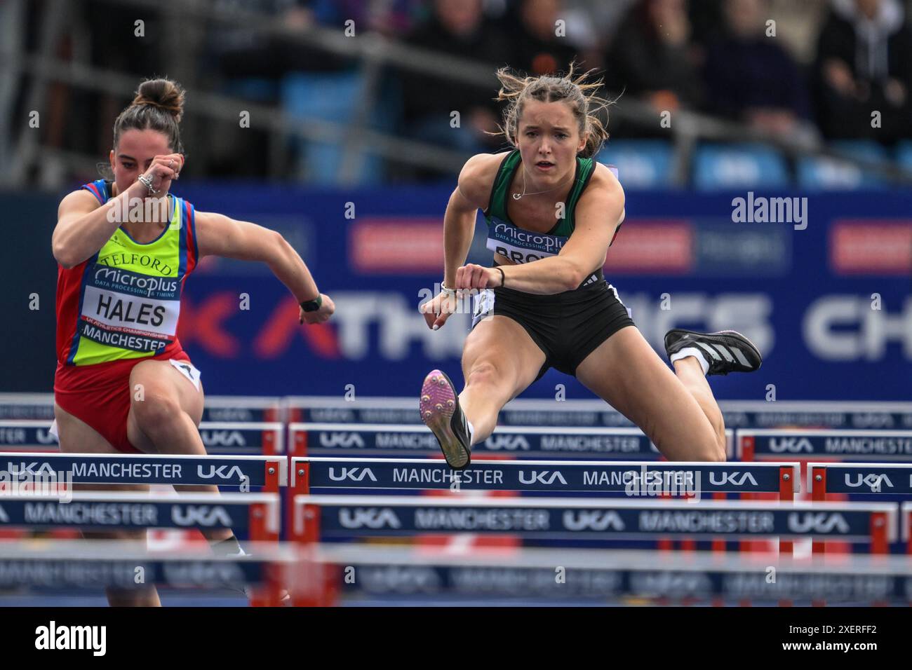 Brown clears the hurdle for the women’s first Heat 100m Hurdles during ...