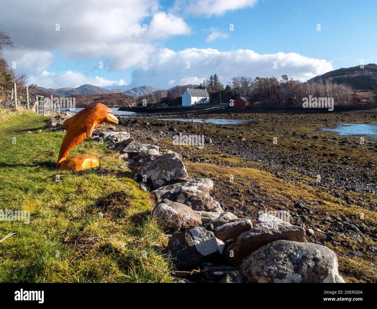 One of the wooden sculptures that lines the route to Dry Island near ...