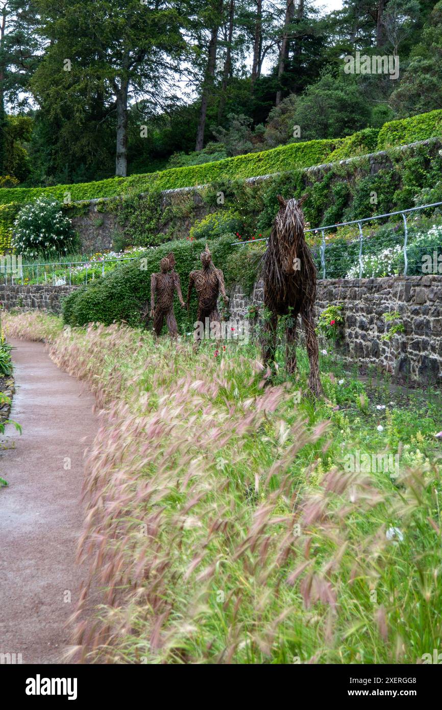 A path at Inverewe Gardens is adorned with horse statues to provide ...