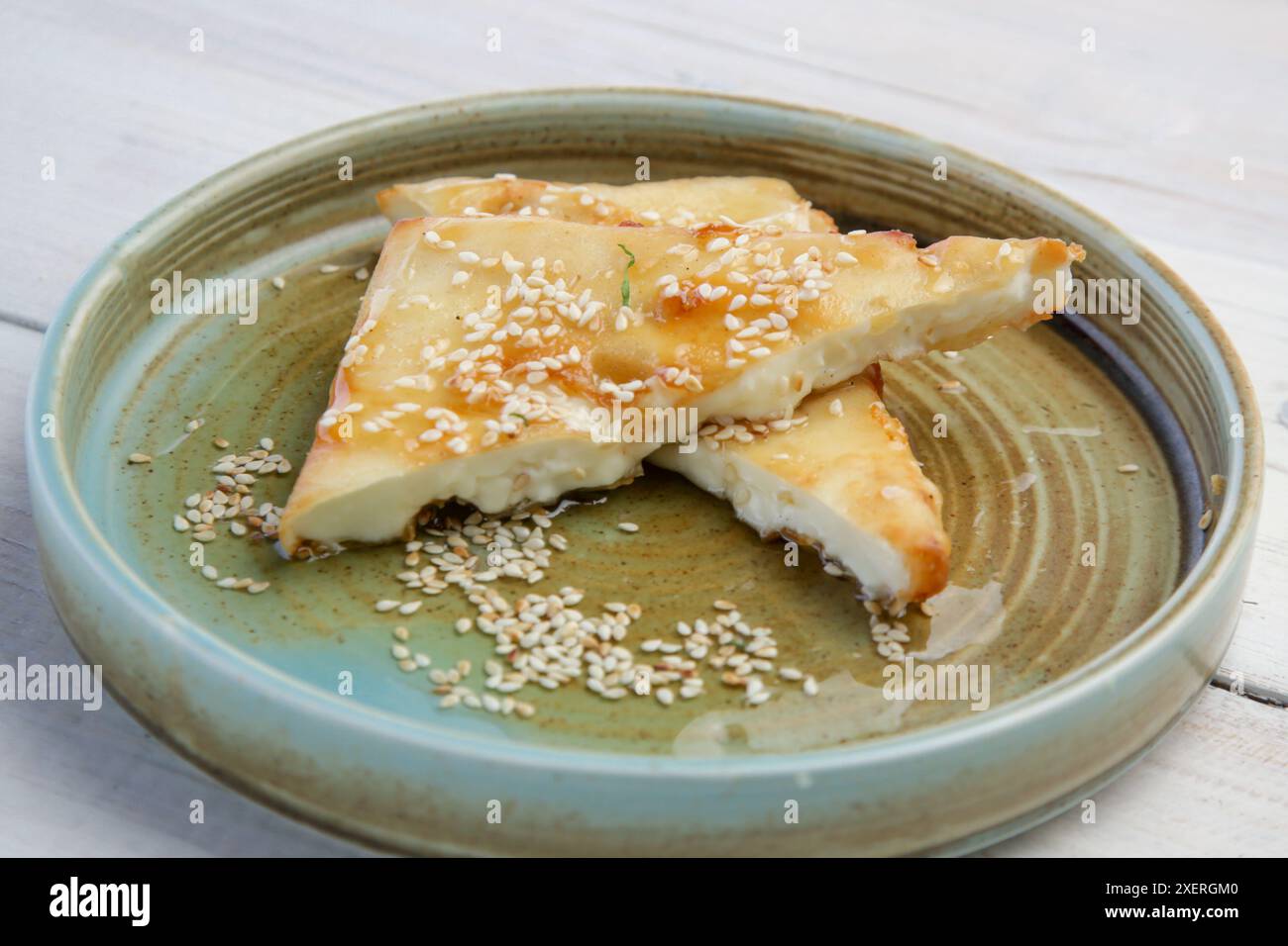 Greek fried feta with honey and sesame seeds Stock Photo - Alamy