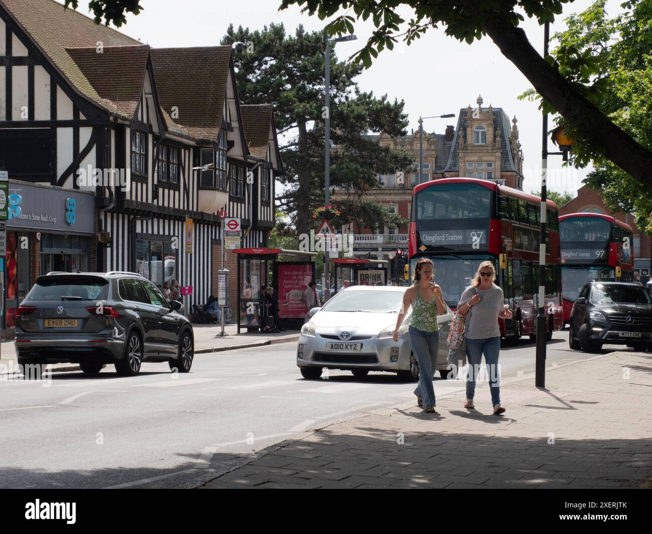 Station Road, shopping area in North Chingford, London with red double ...