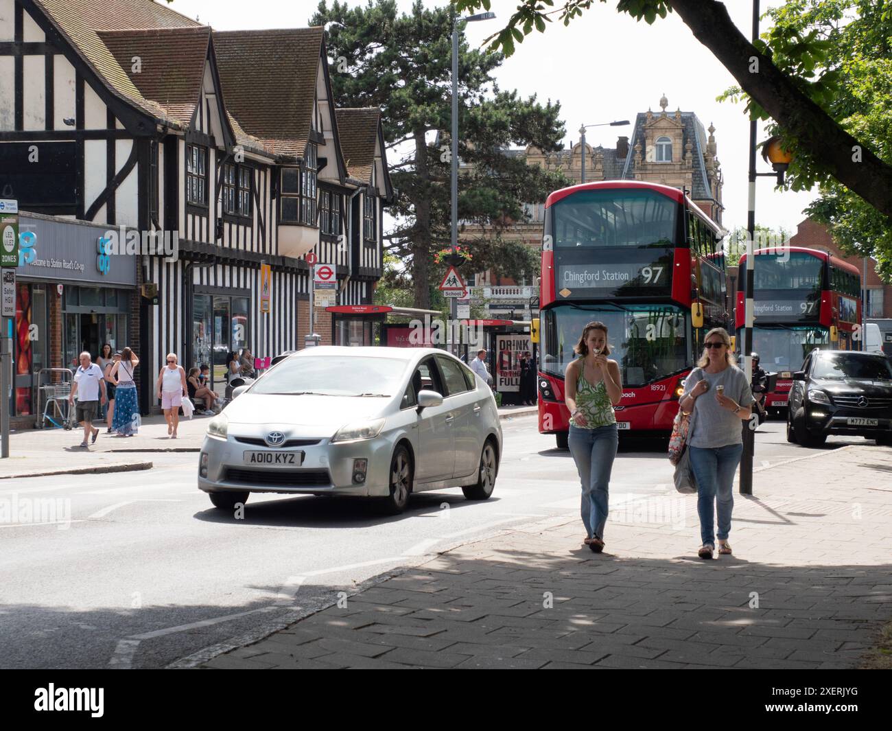 Station Road, shopping area in North Chingford, London with red double ...