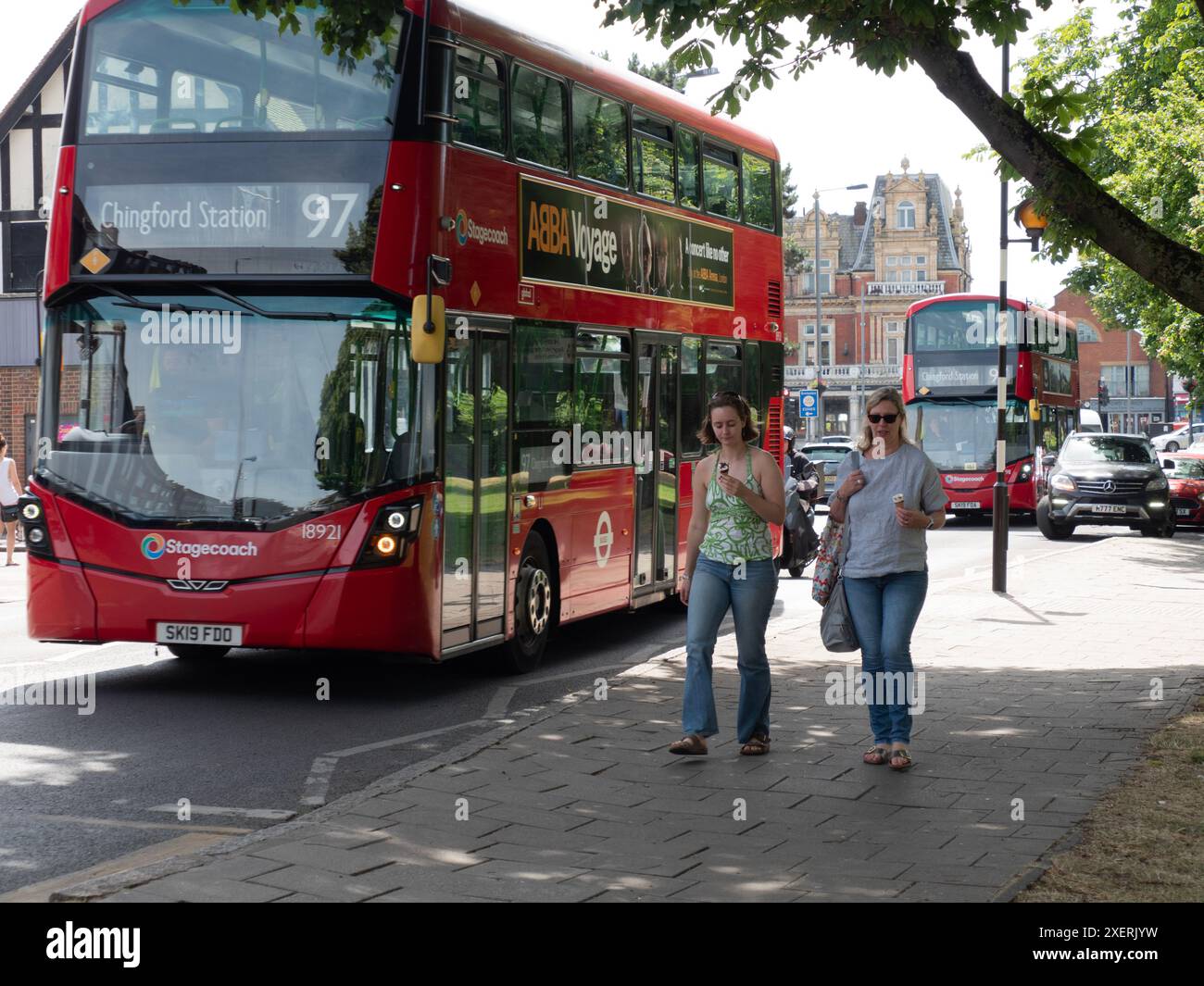 Station Road, shopping area in North Chingford, London with red double ...