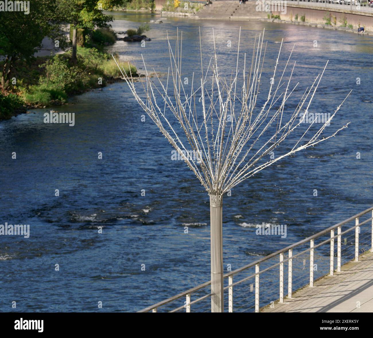 Many wire trees stand by the river Lenne in Altena, wire town ...