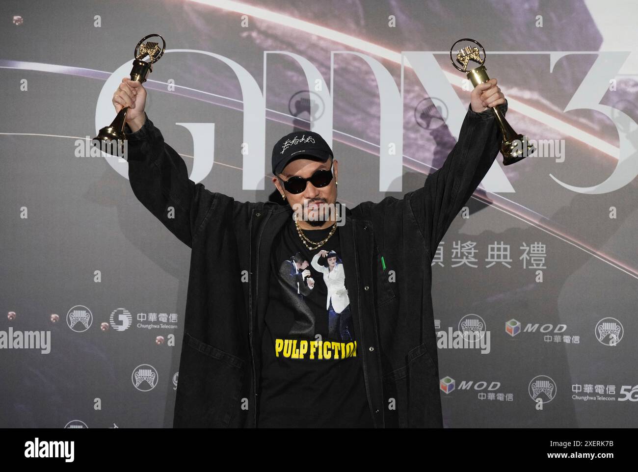 Taiwanese singer MC HotDog holds his awards of Best Male Singer of the ...