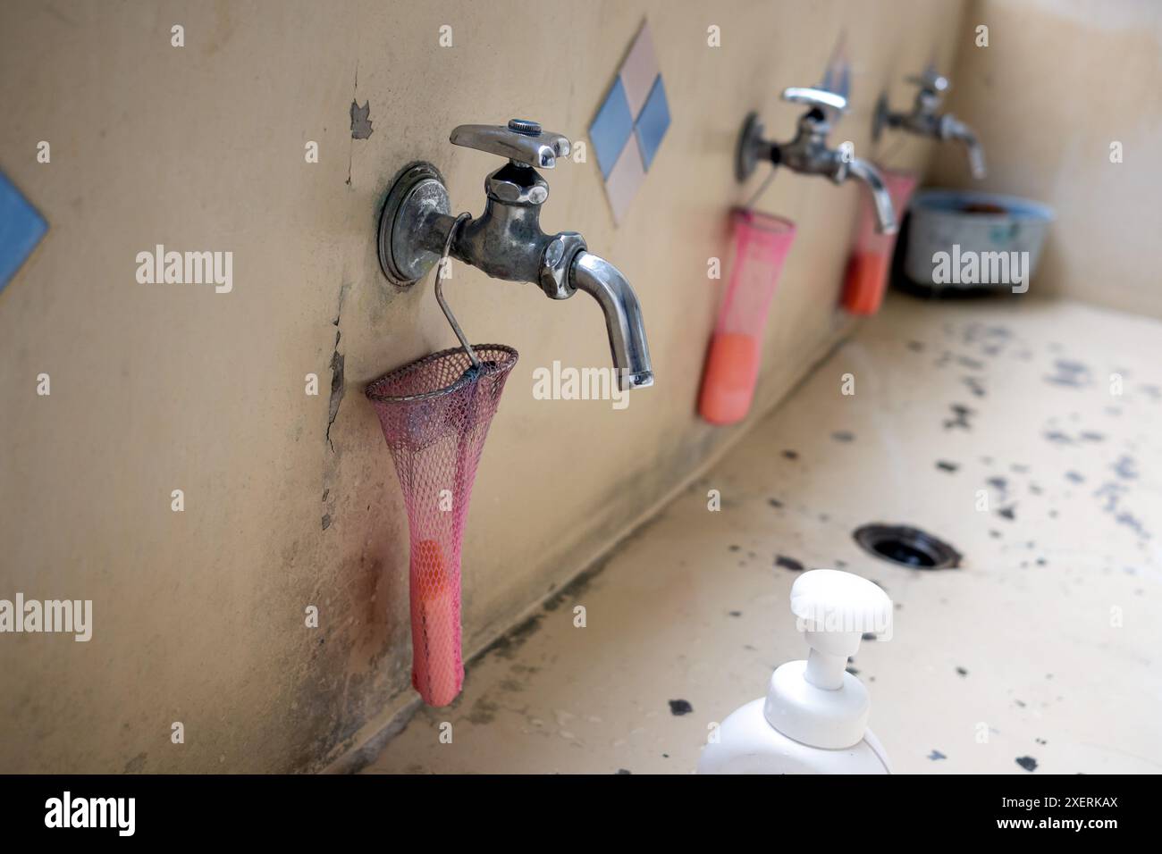 Faucet with mesh soap bar holder at a Japanese public school Stock ...