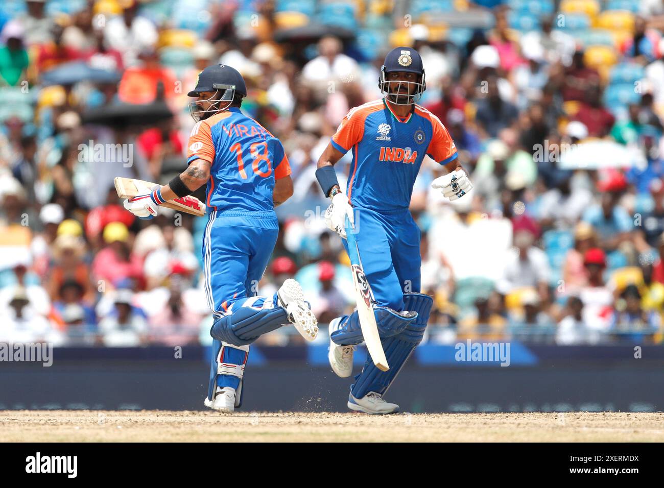 India's Virat Kohli and Axar Patel make a run during the 2024 ICC Men's ...