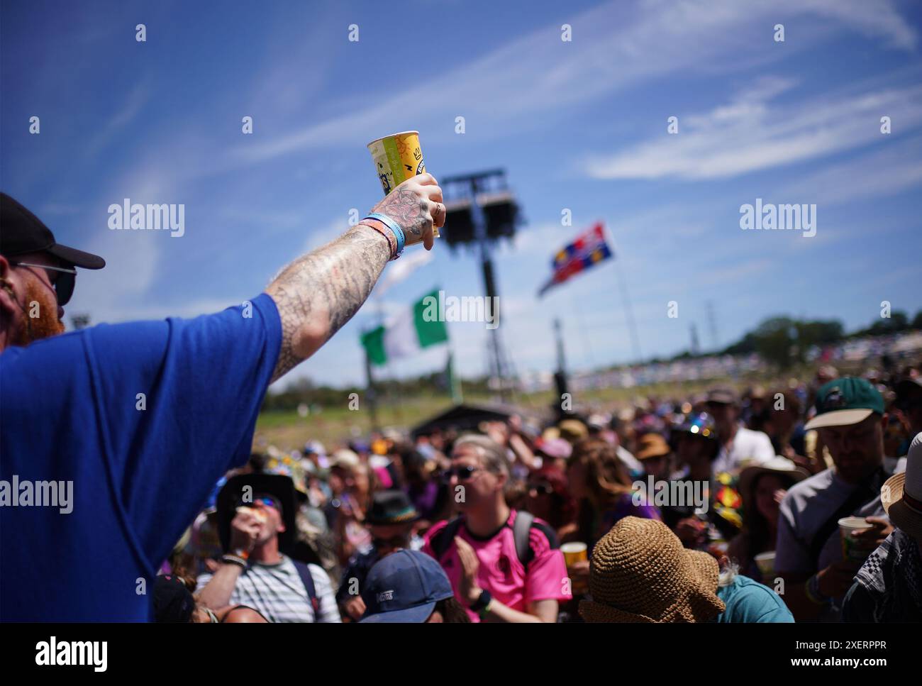 A member of pit security handing out water to the crowd watching Femi ...