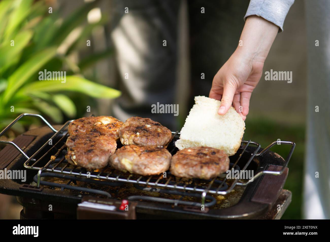 Woman cooked meat baked hi-res stock photography and images - Alamy