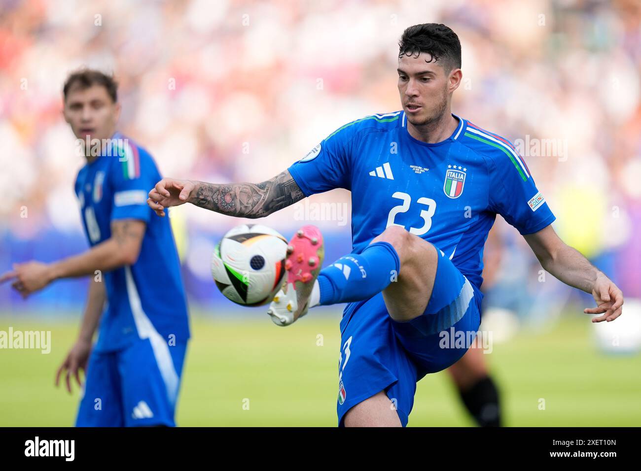 Italy's Alessandro Bastoni (right) in action during the UEFA Euro 2024 ...