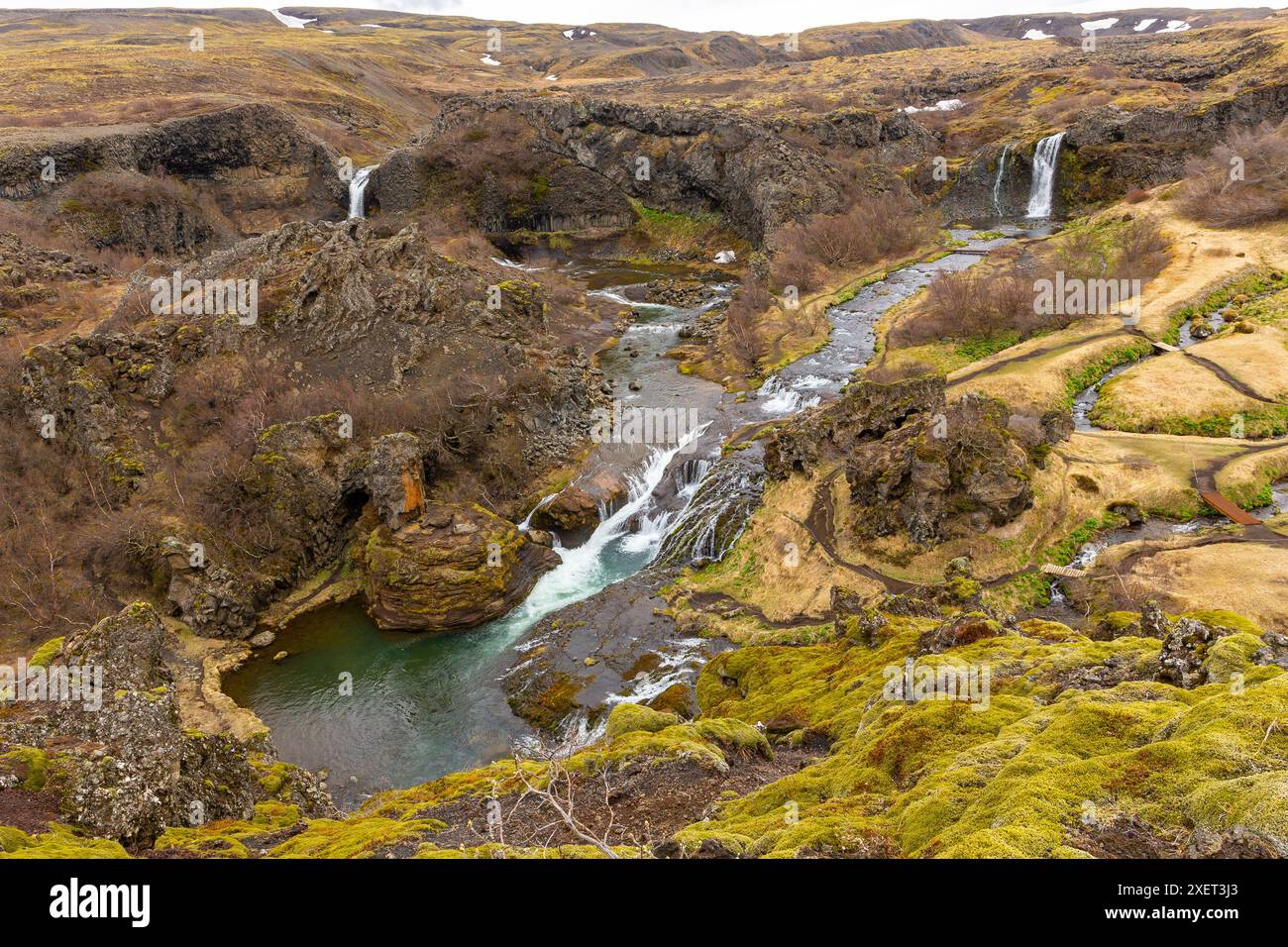 Gjain Canyon landscape with small waterfalls and lush vegetation ...