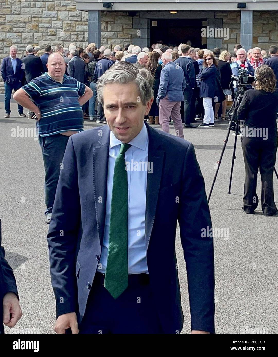 Taoiseach Simon Harris leaves the church after the funeral of veteran ...