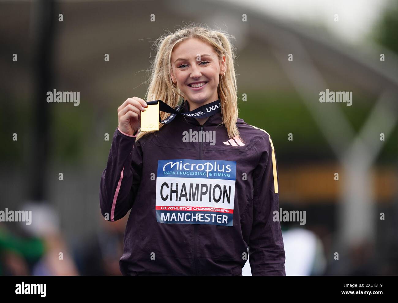 Molly Caudery with her gold medal after winning the Women's Pole Vault ...