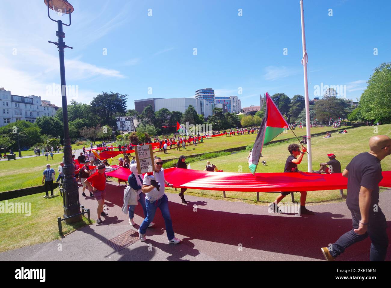 Over 500 people held and carried the peoples red line in Bournemouth June 29 2024. Holding a ...