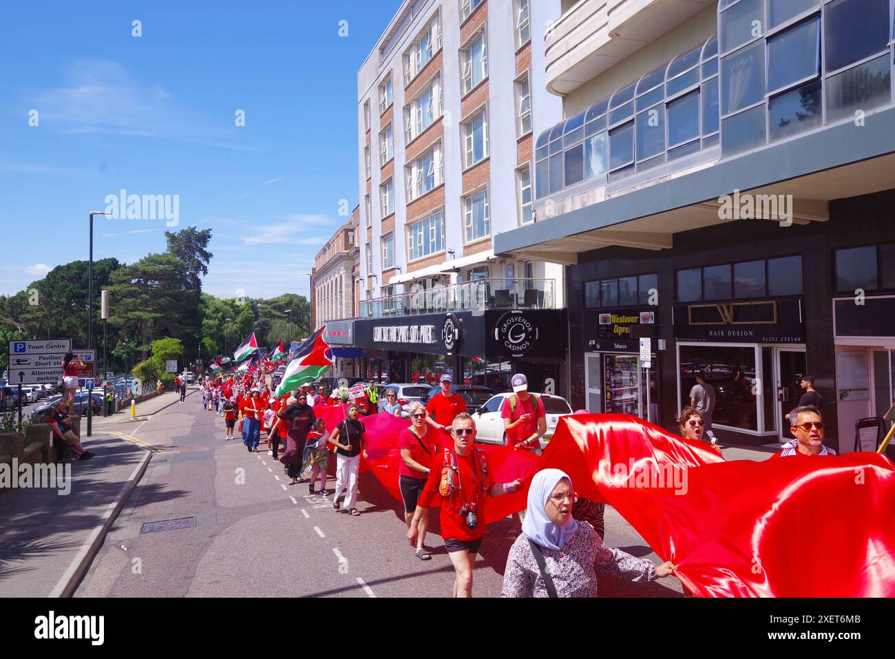 Over 500 people held and carried the peoples red line in Bournemouth ...