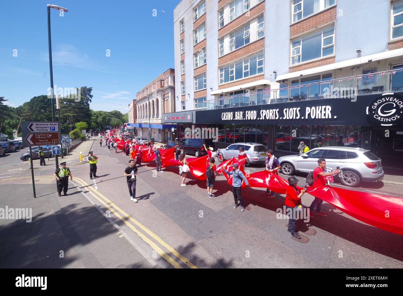 Over 500 people held and carried the peoples red line in Bournemouth ...