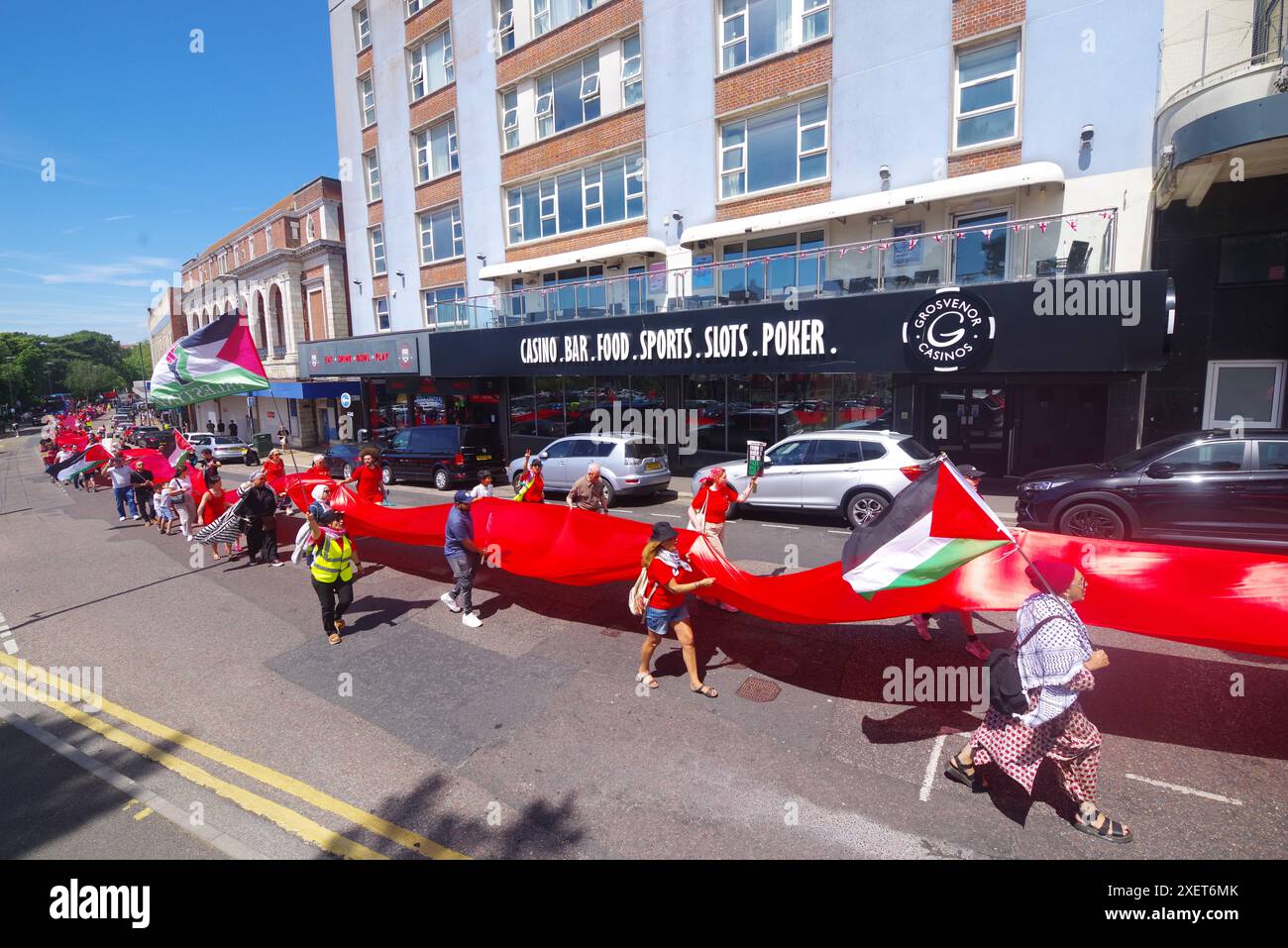 Over 500 people held and carried the peoples red line in Bournemouth ...