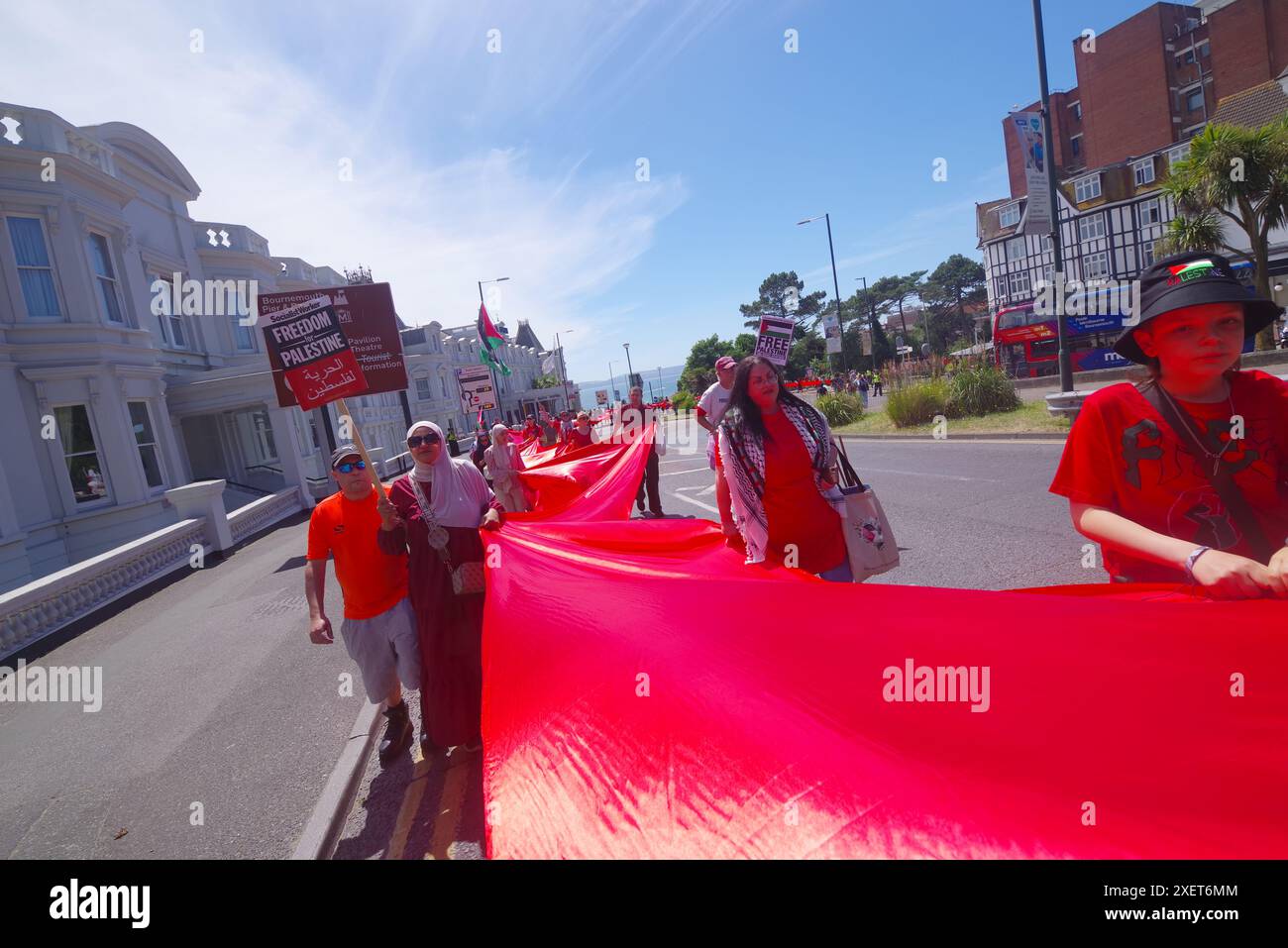 Over 500 people held and carried the peoples red line in Bournemouth ...