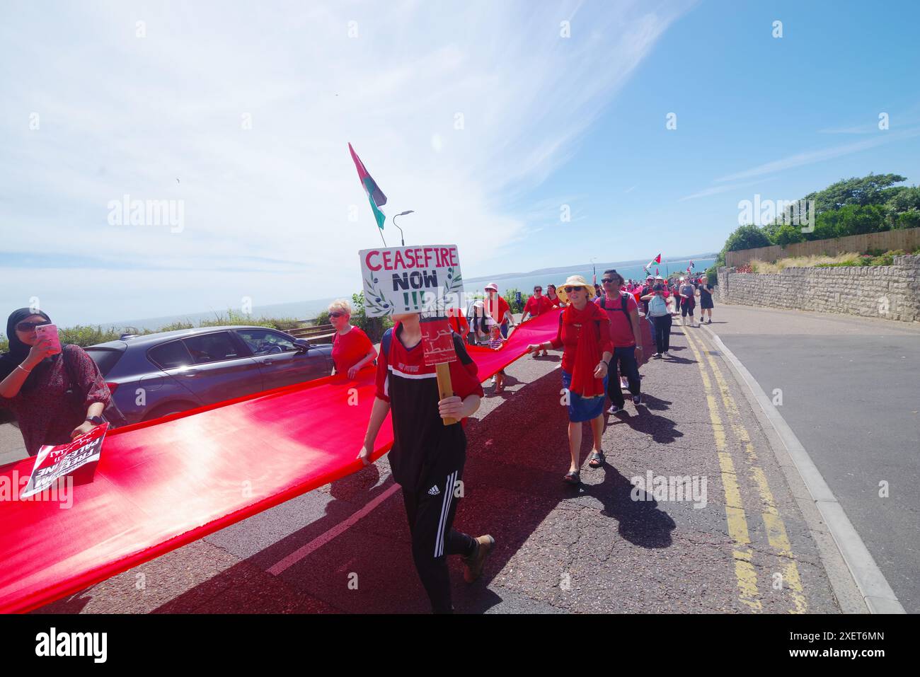 Over 500 people held and carried the peoples red line in Bournemouth ...