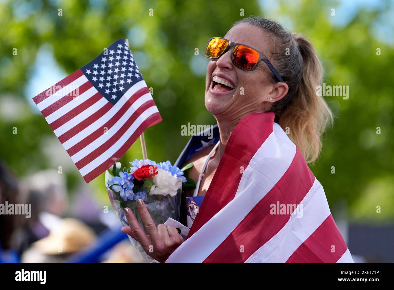 Robyn Stevens celebrates after winning the women's 20km race walk at ...