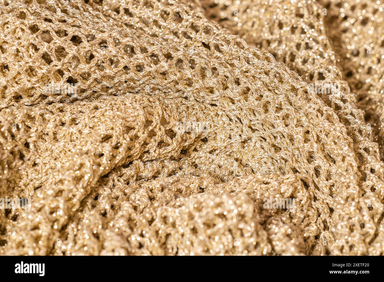 Closeup of wrinkled mesh fabric with golden thread Stock Photo - Alamy