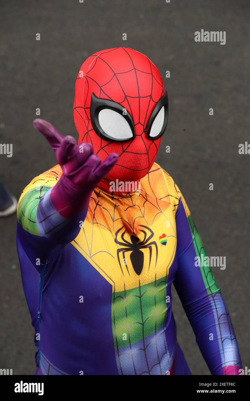 London, UK. 29th June, 2024. A person dressed as Spider Man in LGBT ...