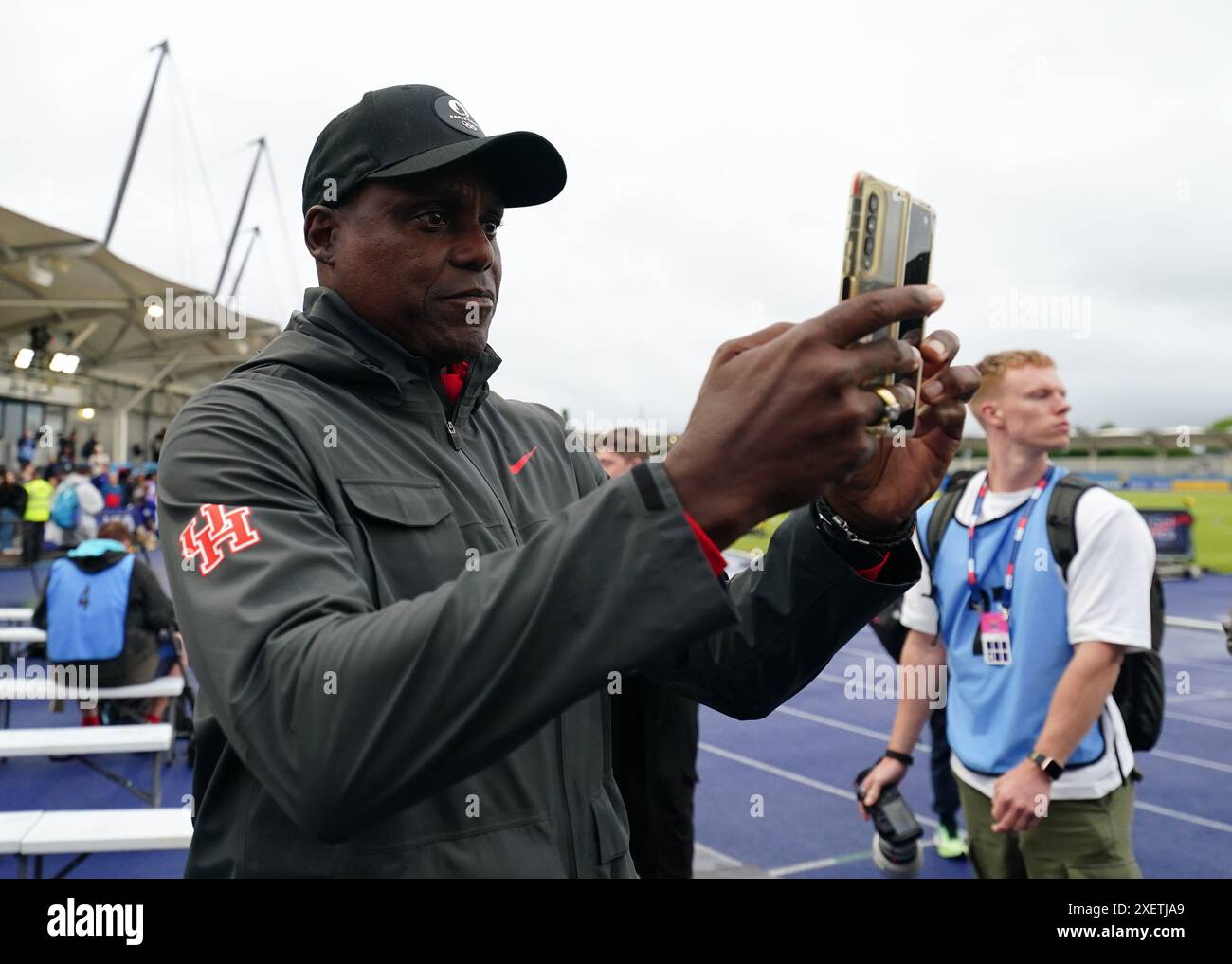 Carl Lewis after Louie Hinchliffe wins the Men's 100m final during day ...