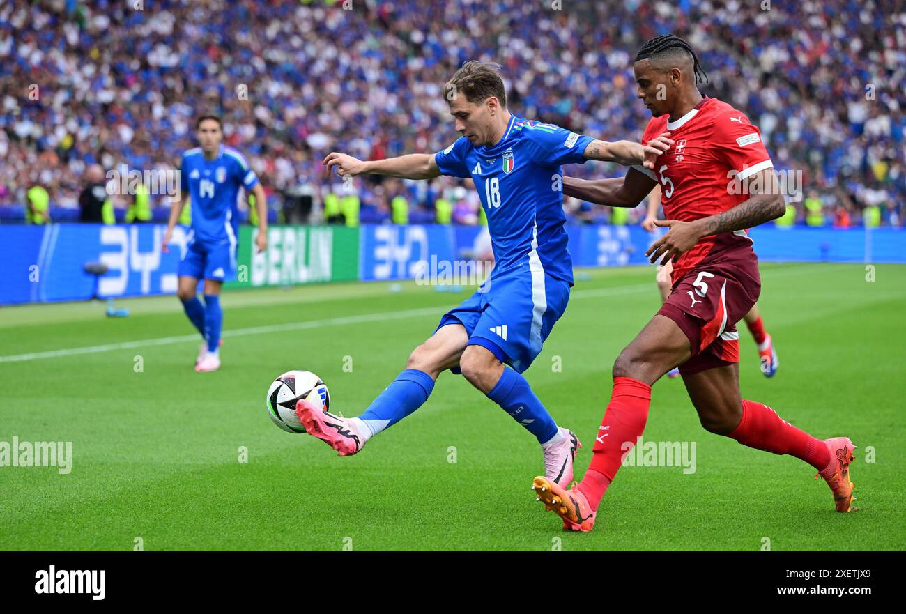 Berlin, Germany. 29th June, 2024. Nicolo Barella of Italy and Manuel ...