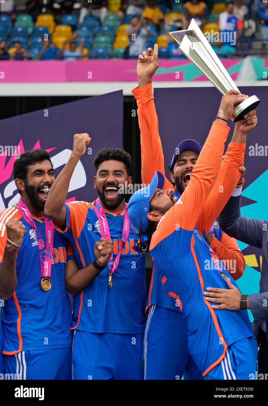 India's captain Rohit Sharma lifts the winners' trophy after India won ...