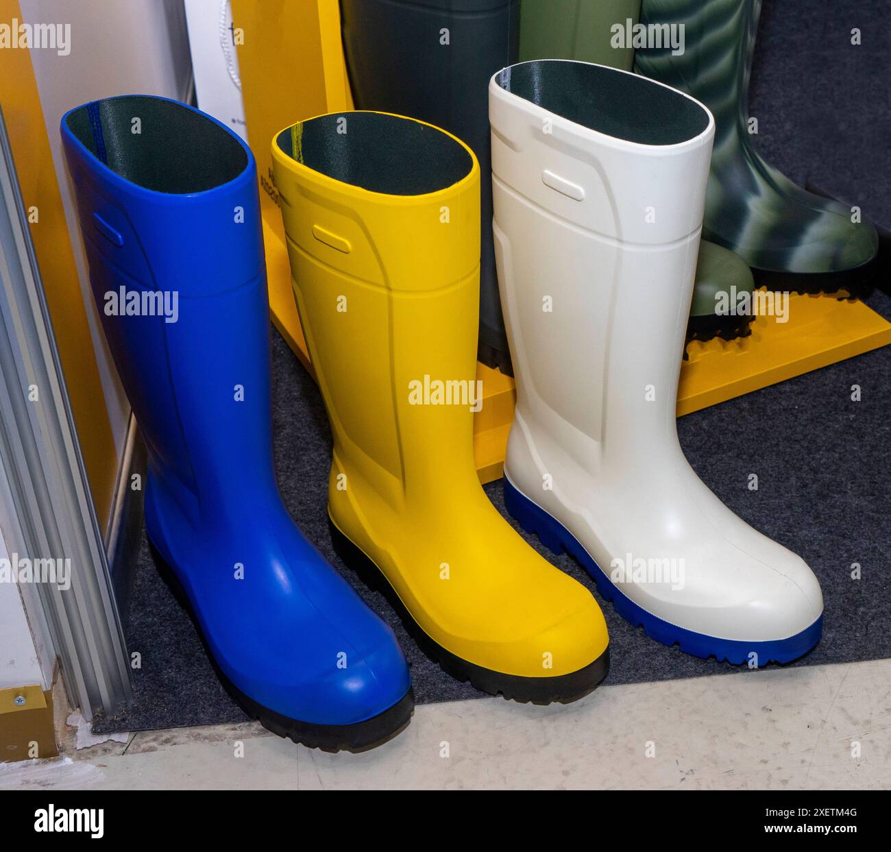 colorful protective rubber boots on the shop window Stock Photo - Alamy