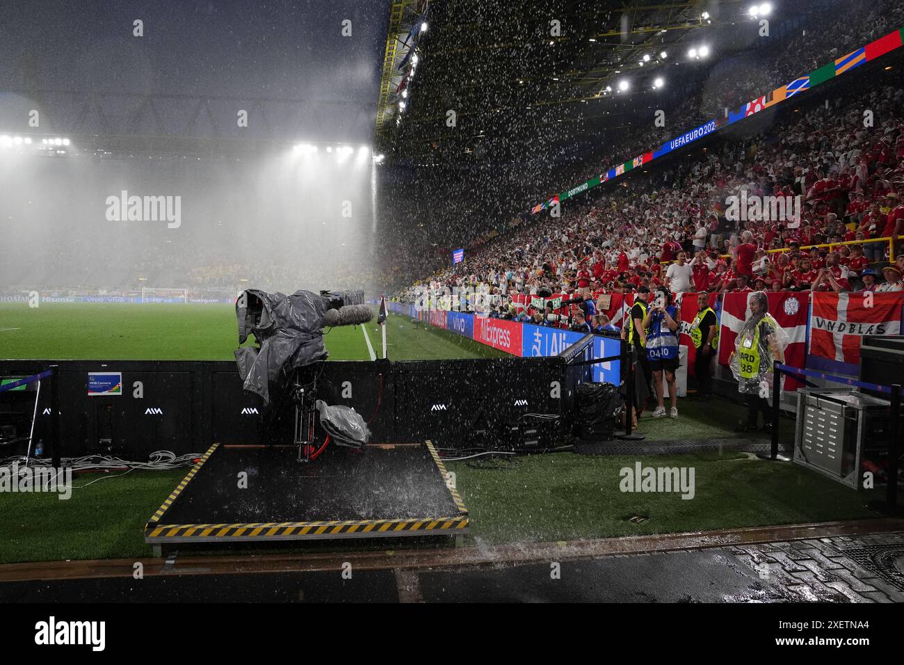 A general view of rain in the stadium during a break of play due to ...