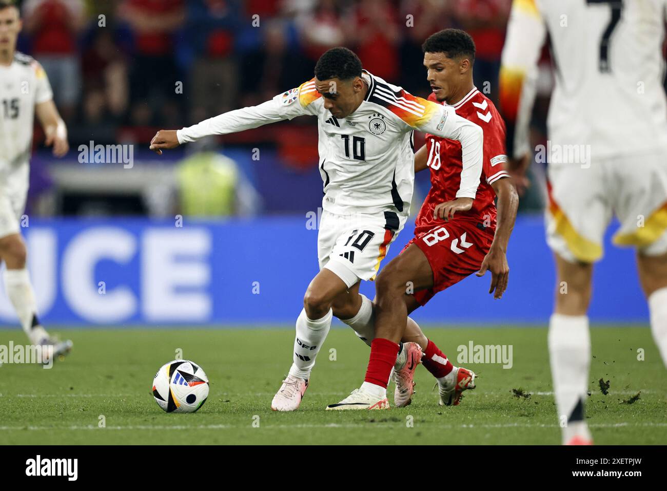 Dortmund - (l-r) Jamal Musiala of Germany, Alexander Bah of Denmark ...