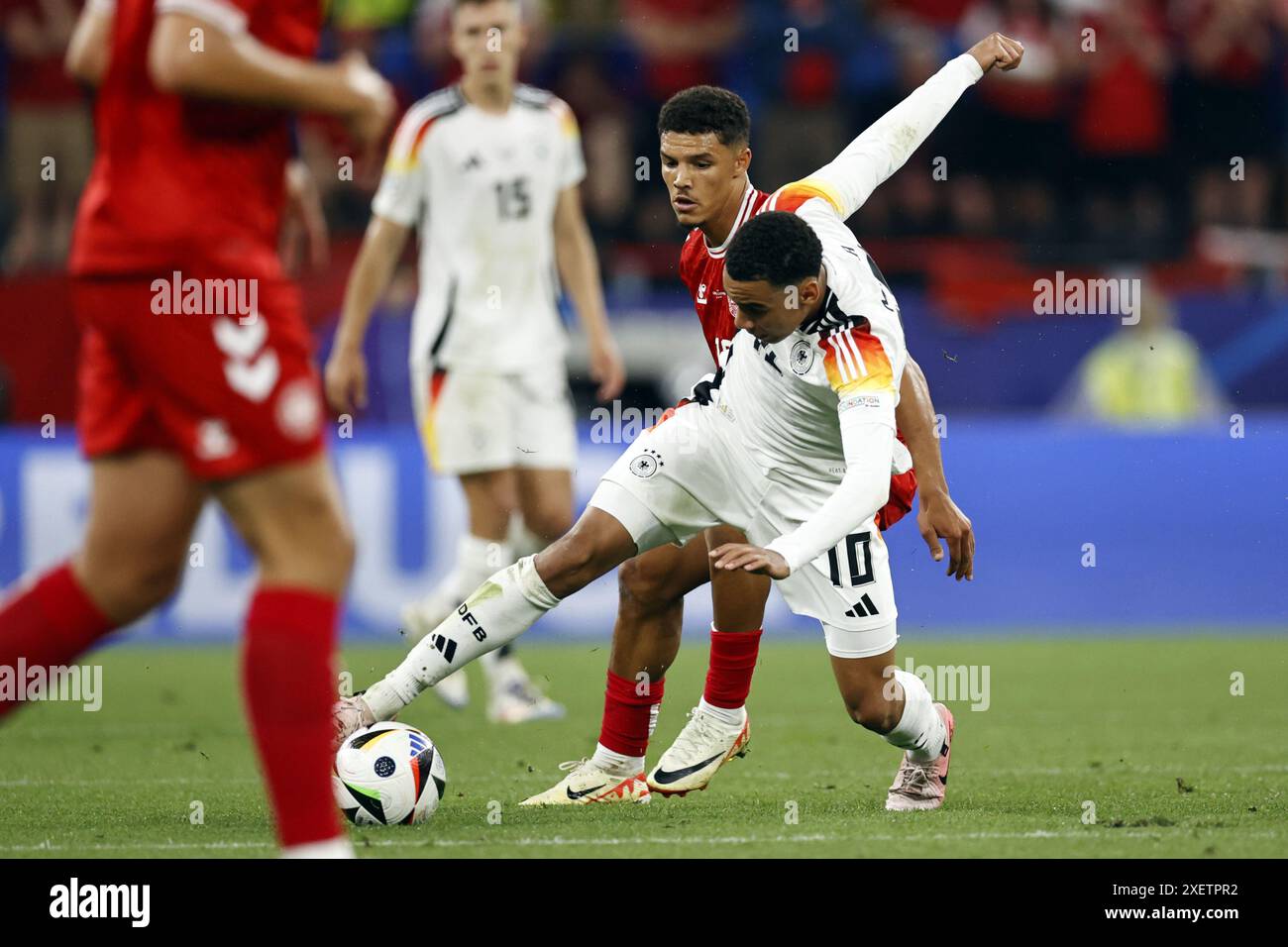 Dortmund - (l-r) Jamal Musiala of Germany, Alexander Bah of Denmark ...